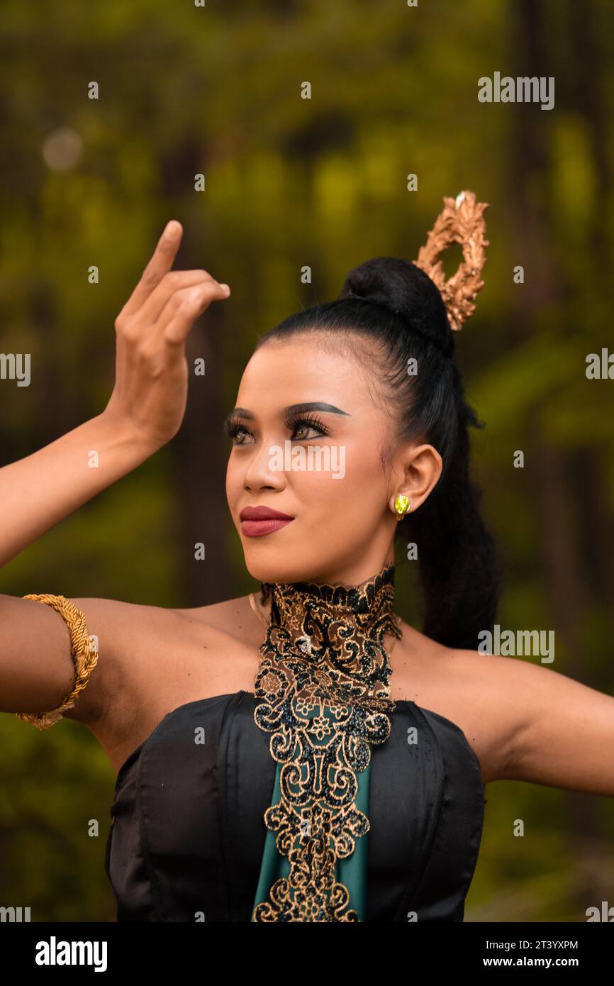 Portrait of a Balinese woman with beautiful makeup and tied black hair ...