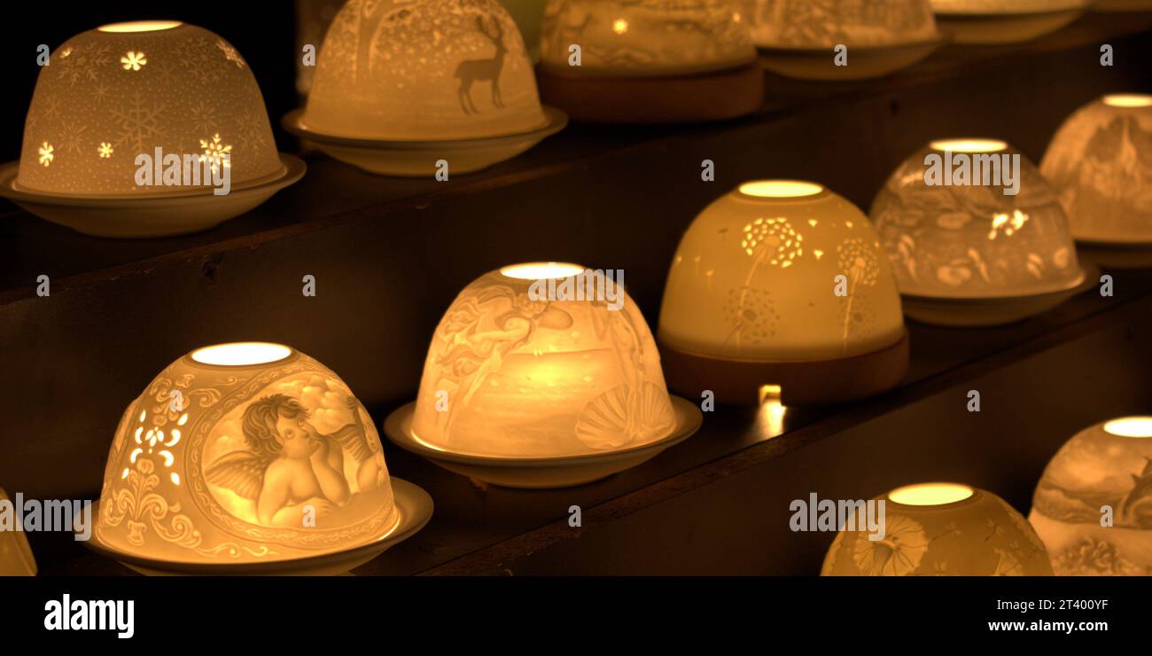 Rows of semi-circle ceramic lanterns lit by candlelight + decorated ...