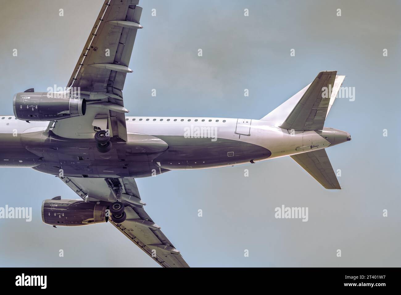 Passenger plane preparing to land, view from below. Flying plane Stock ...
