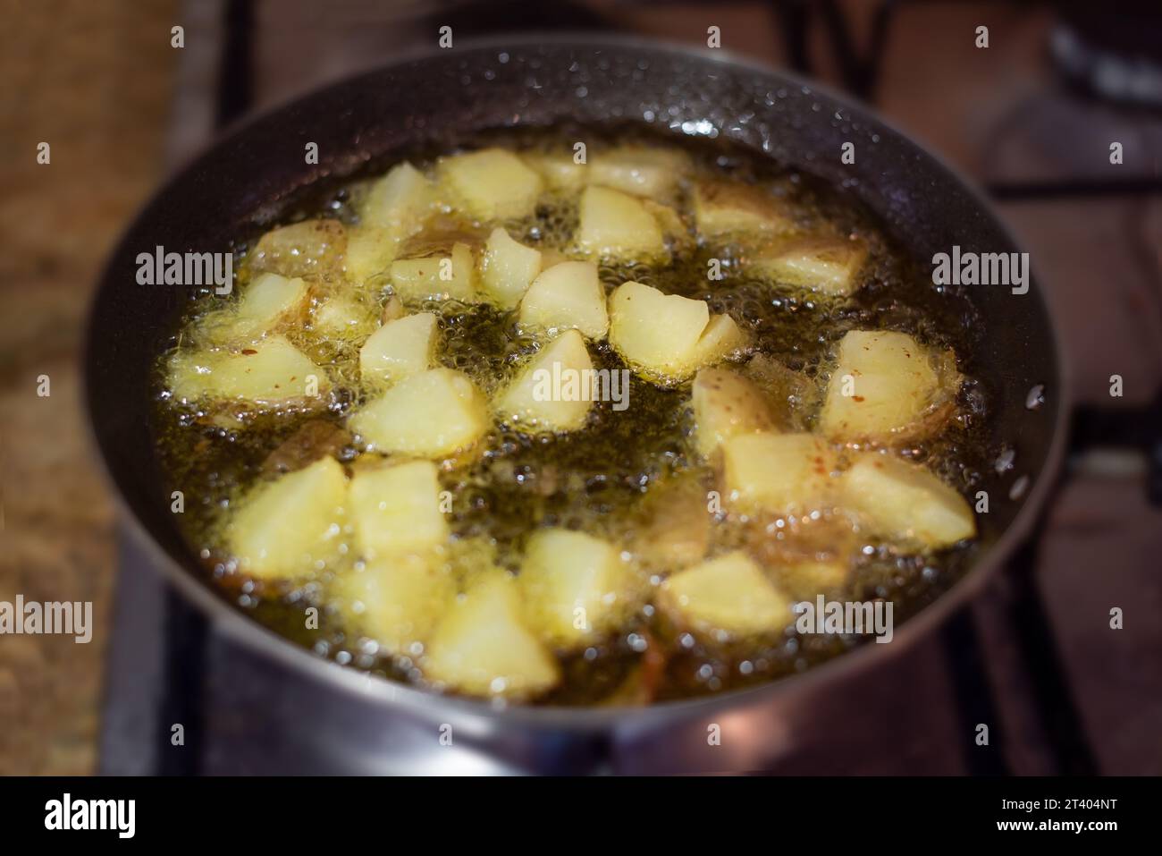 Golden potatoes sizzle in hot hi-res stock photography and images - Alamy