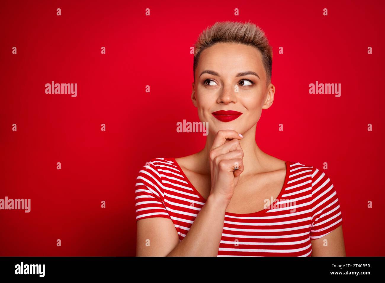 Portrait of young smart woman thinking with cherry pomade touch chin ...
