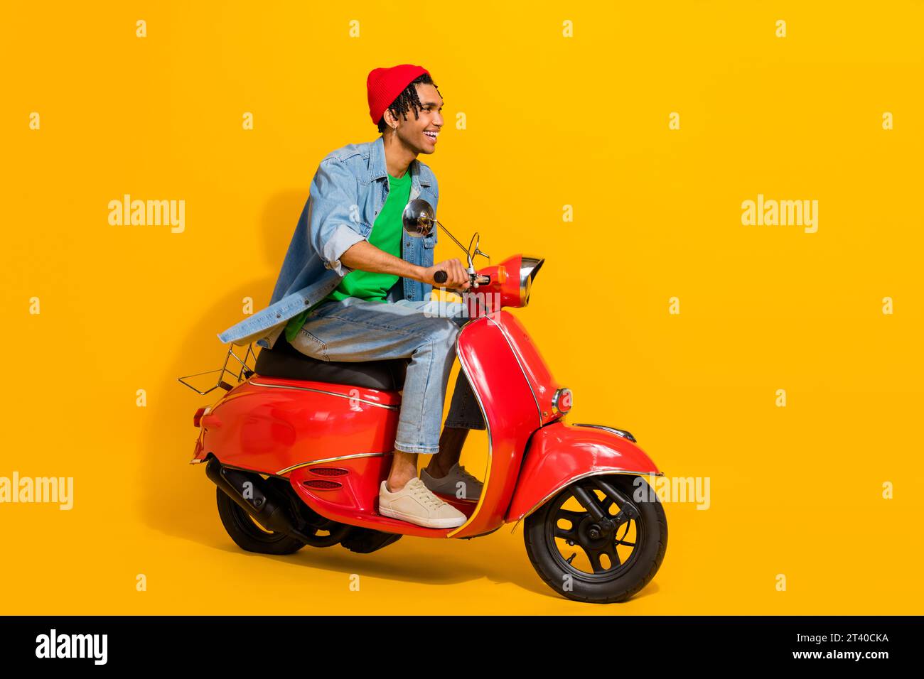 Full length photo of cute young male driving riding motorcycle dressed ...