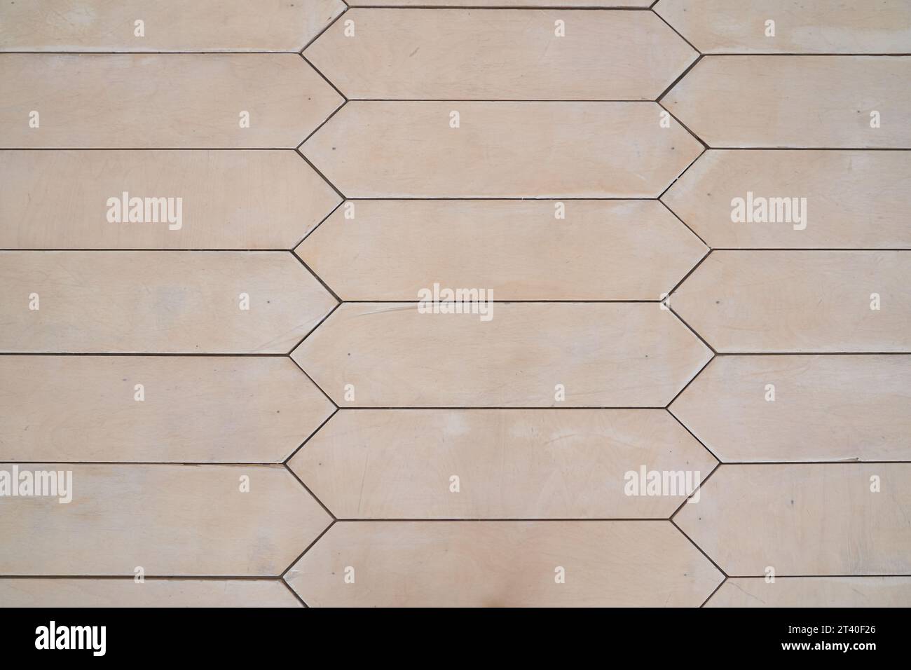 Beige tiles of hexagonal long shape. Floor tiles, mosaic texture ...