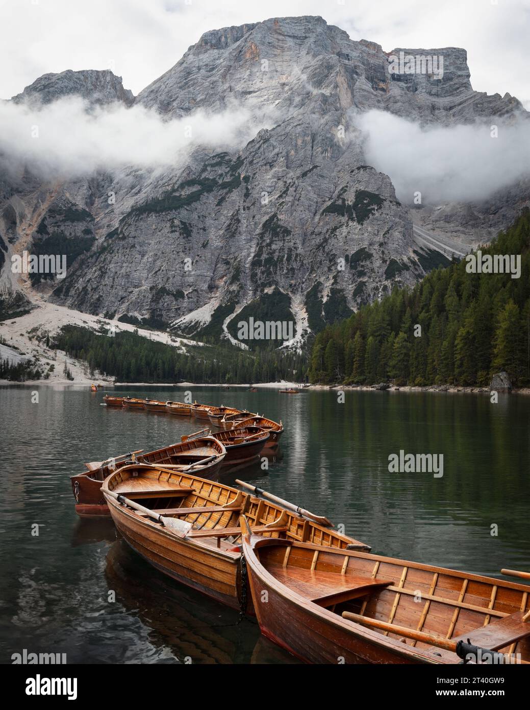 View of traditional wooden rowing boats on scenic Lago di Braies in ...