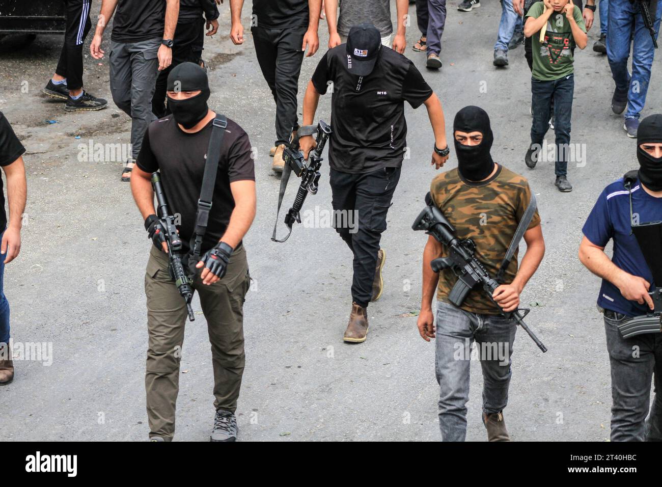 Palestinian gunmen attend the funeral of Aysar al-Amer, 25, a local ...