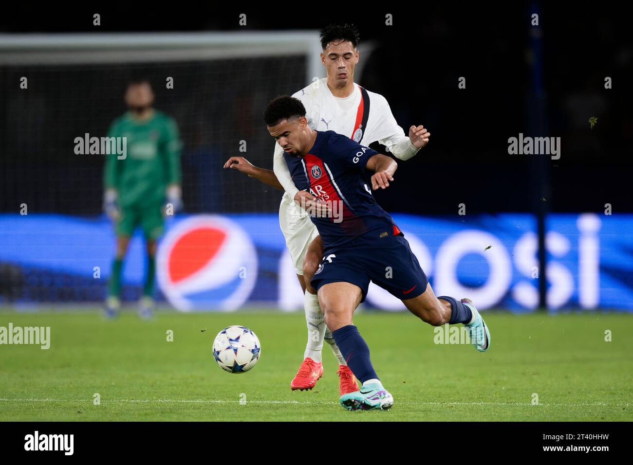 Warren Zaire-Emery of Paris Saint-Germain FC is challenged by Tijjani ...