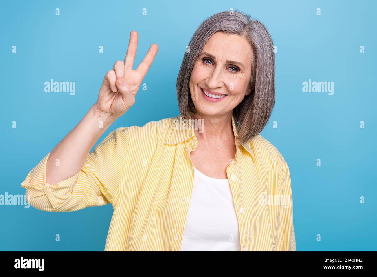 Photo of cool sweet lady wear yellow shirt smiling showing v-sign ...
