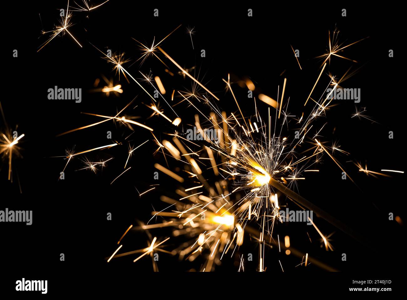 Close up ggroup of several bright firework sparklers over black, background for Christmas ...