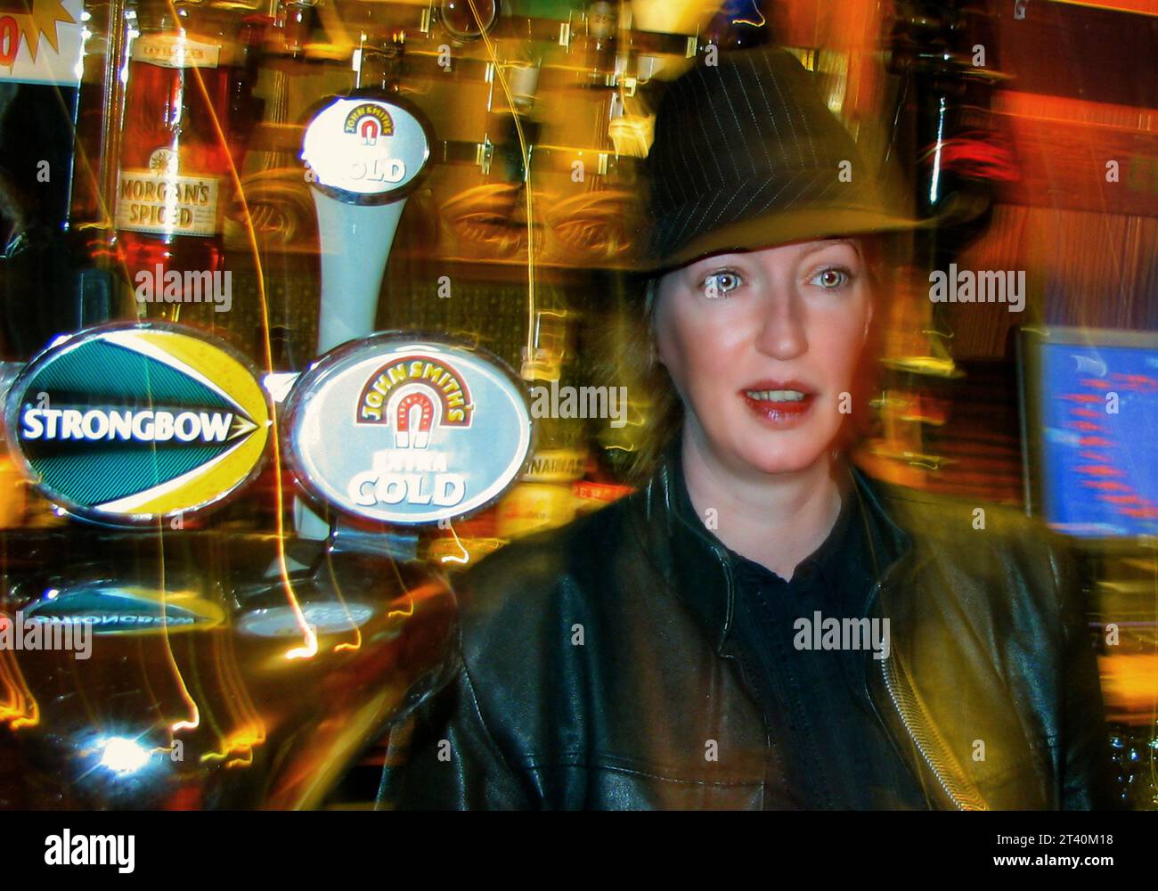 Bartender in an English pub late at night Stock Photo - Alamy