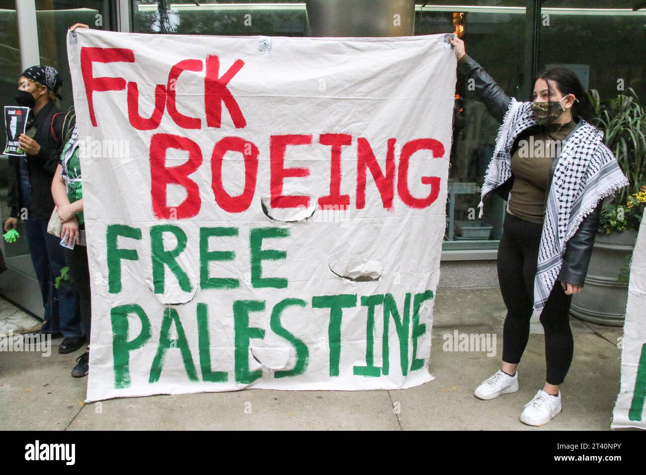 Activists attending the Boot Boeing! Free Palestine march and rally ...