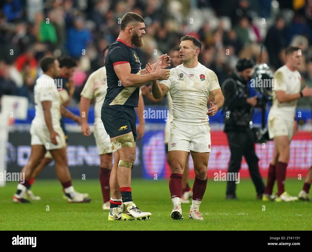 Argentina's Marcos Kremer (left) shakes hands with England's Danny Care ...
