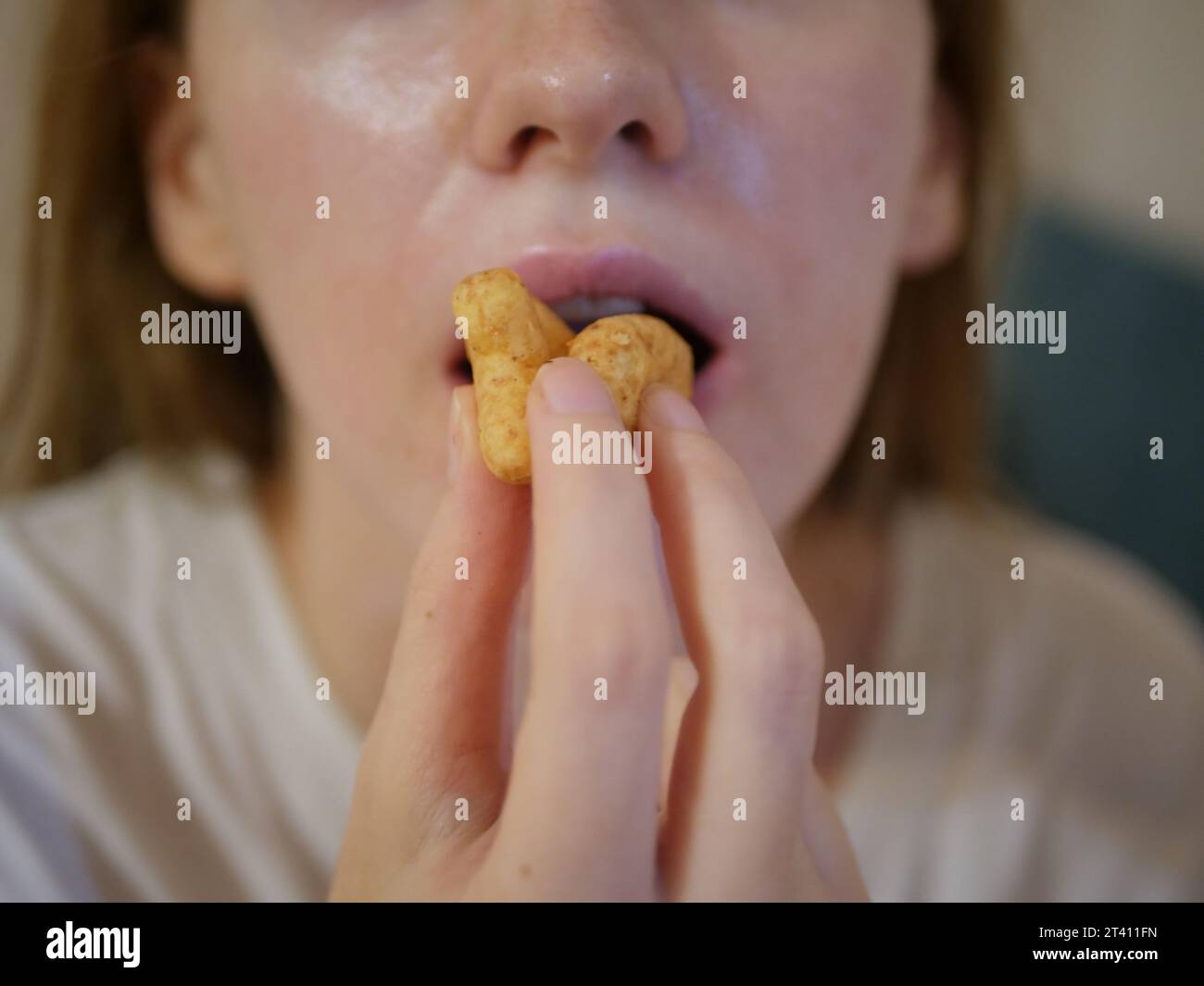 Closse up of girl mouth eating food Stock Photo - Alamy