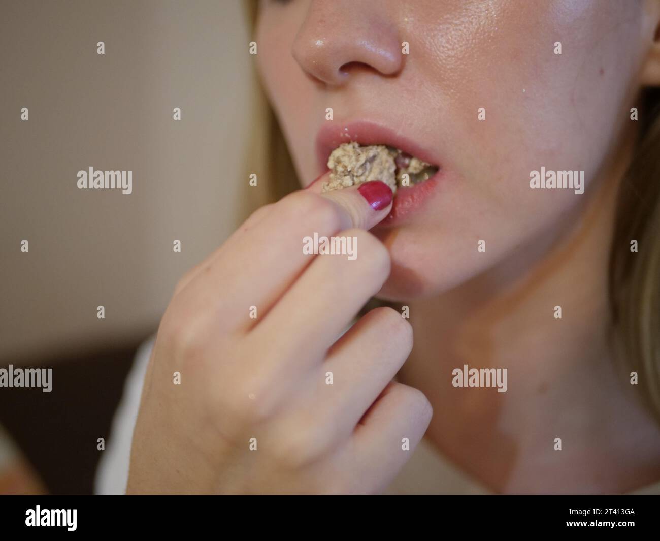 Closse up of girl mouth eating food Stock Photo - Alamy