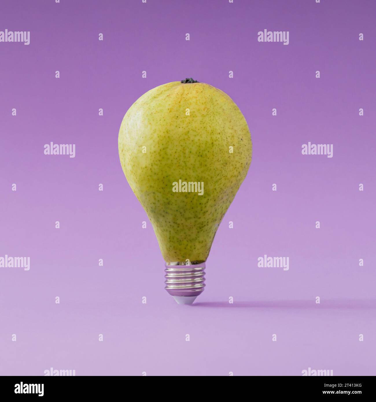 Pear light bulb on fancy violet background. Minimal idea concept with ...
