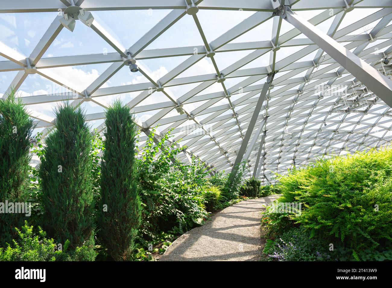 pebbles path under dome with glass roof, indoor garden with walkway and ...