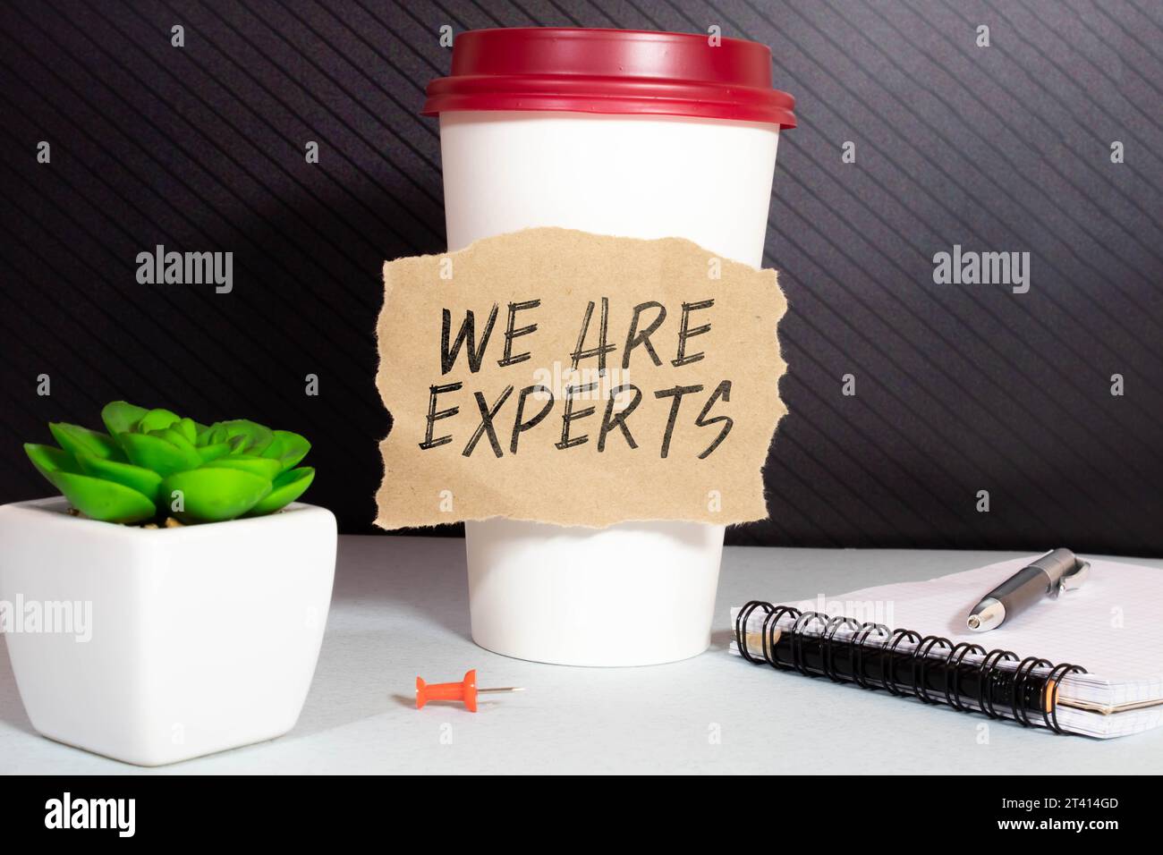 ASK OUR EXPERTS text on a sticky on chart Stock Photo - Alamy