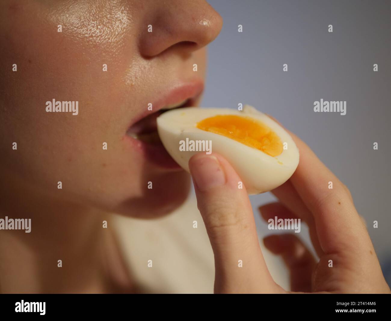 Closse up of girl mouth eating food Stock Photo - Alamy
