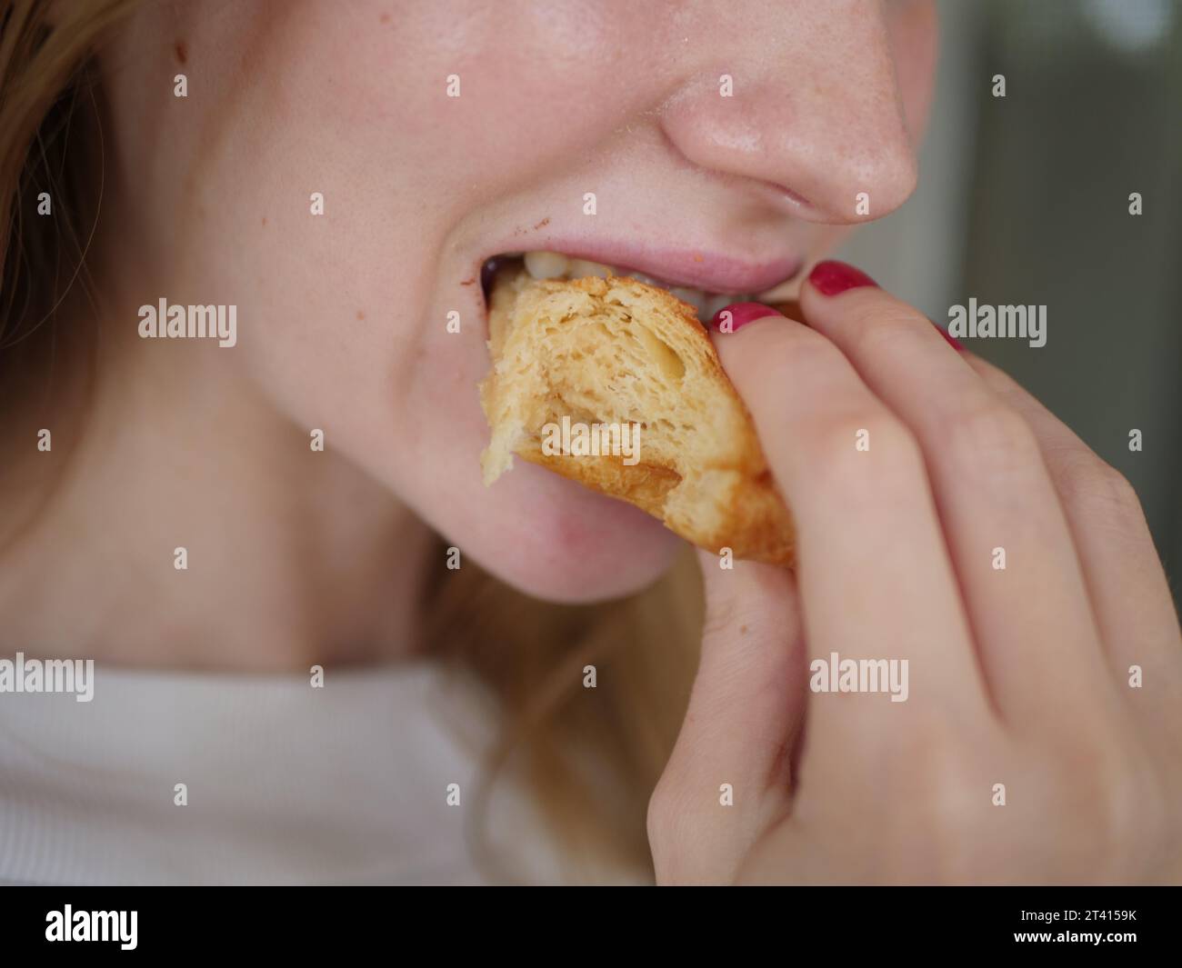 Closse up of girl mouth eating food Stock Photo - Alamy