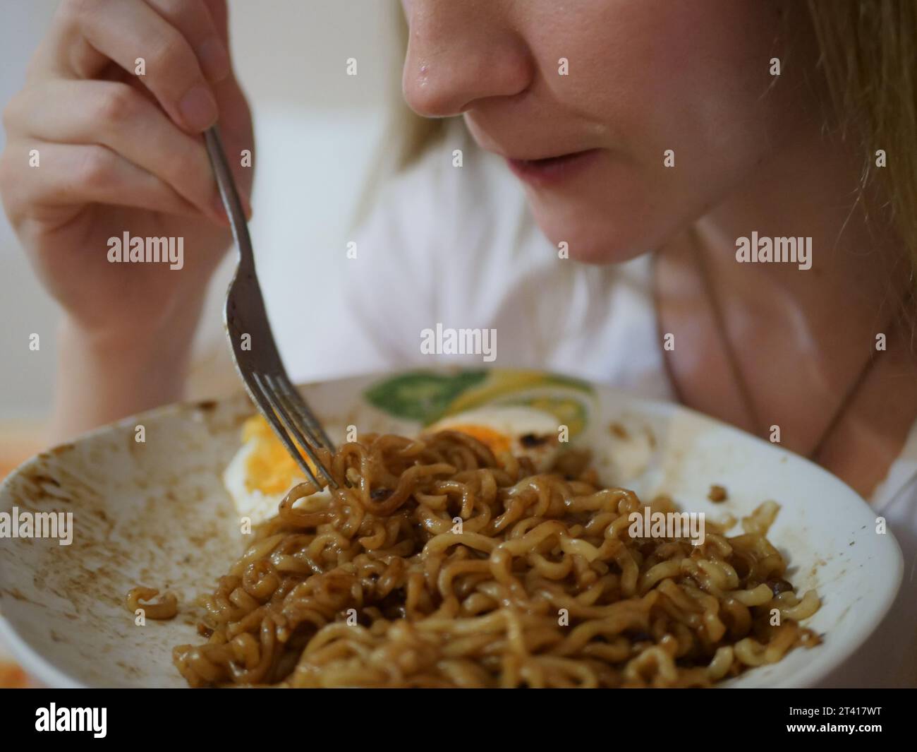 Closse up of girl mouth eating food Stock Photo - Alamy