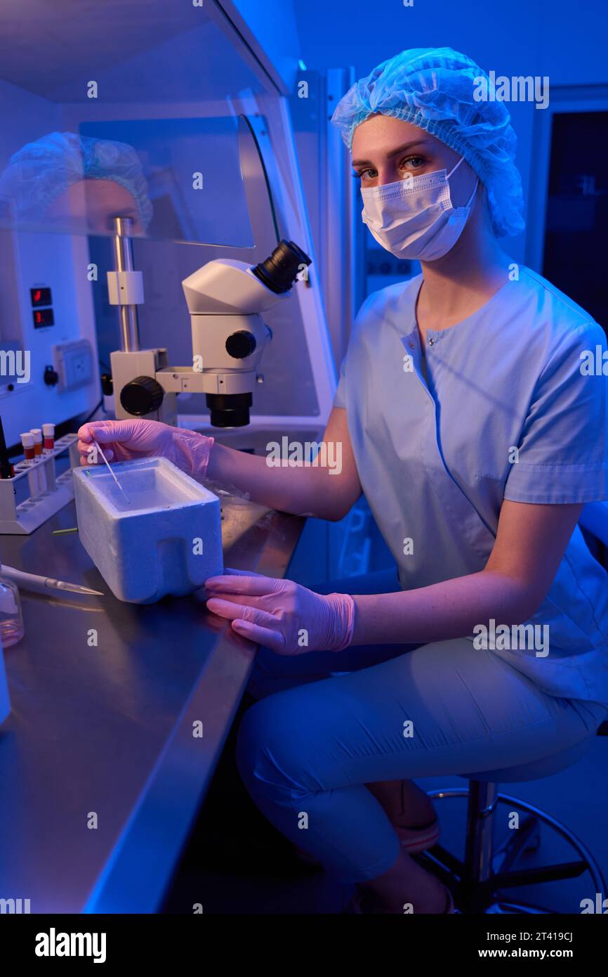 Cryopreservation expert freezing cells in cryogenic freezer box Stock ...