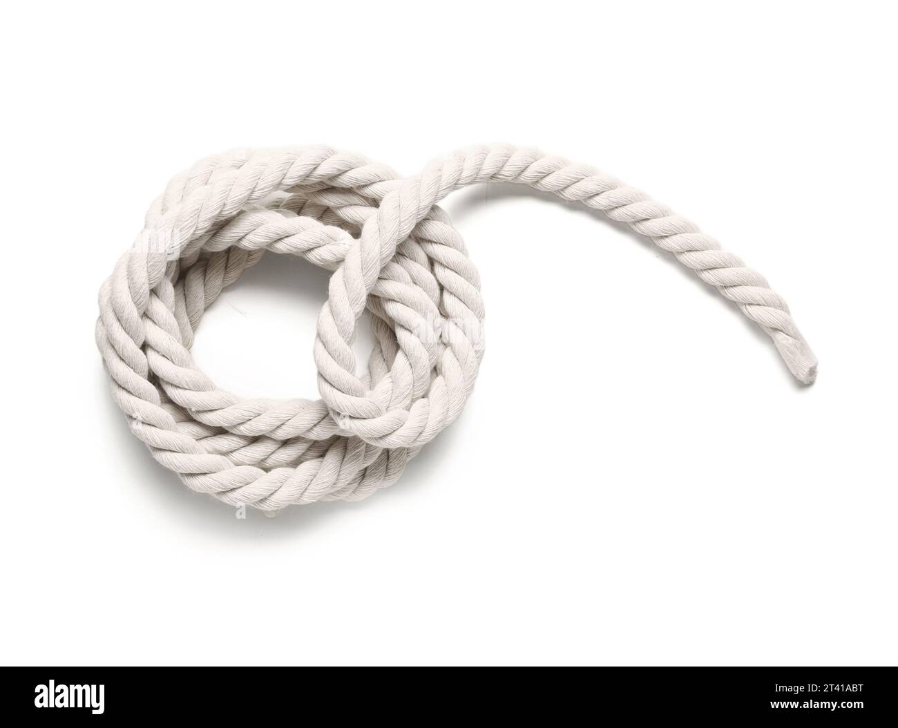 Rolled rope on white background Stock Photo - Alamy