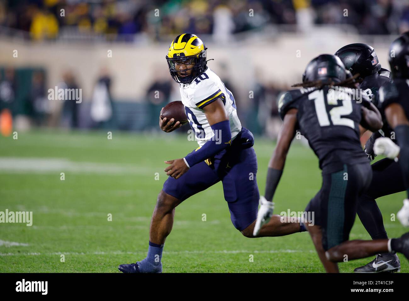Michigan quarterback Alex Orji runs during an NCAA college football ...