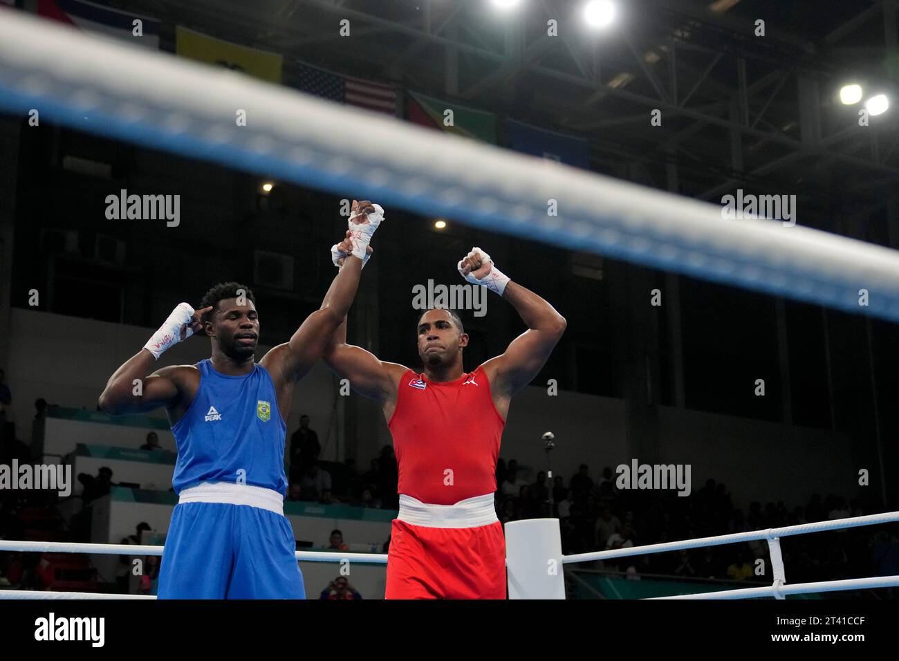 Cuba's Arlen Lopez, right, celebrates defeating Brazil's Wanderley De ...