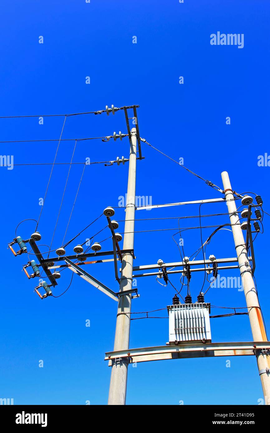 Transformer and pole under the blue sky, closeup of photo Stock Photo ...