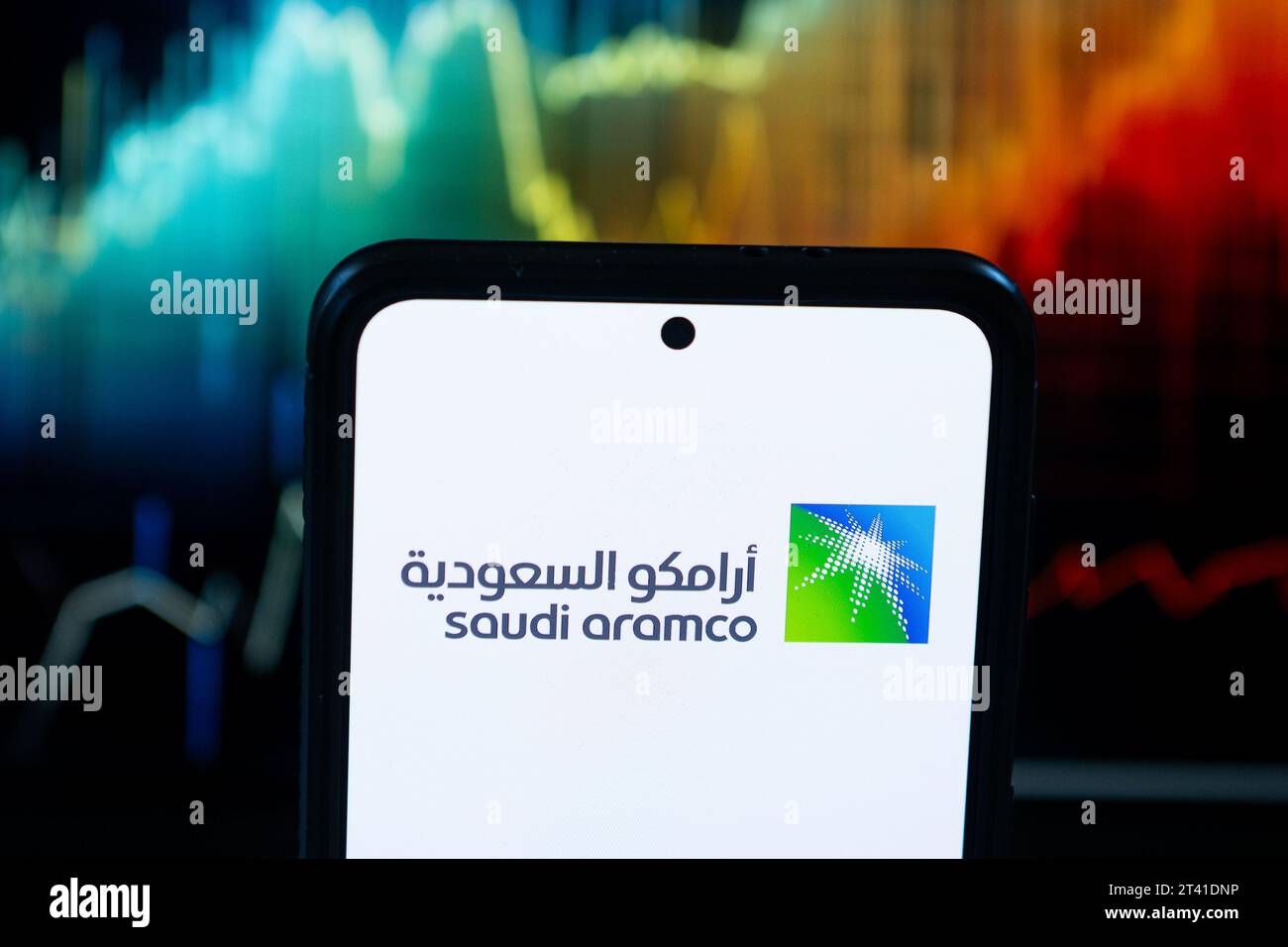 In this photo illustration a Saudi Aramco logo seen displayed on a ...