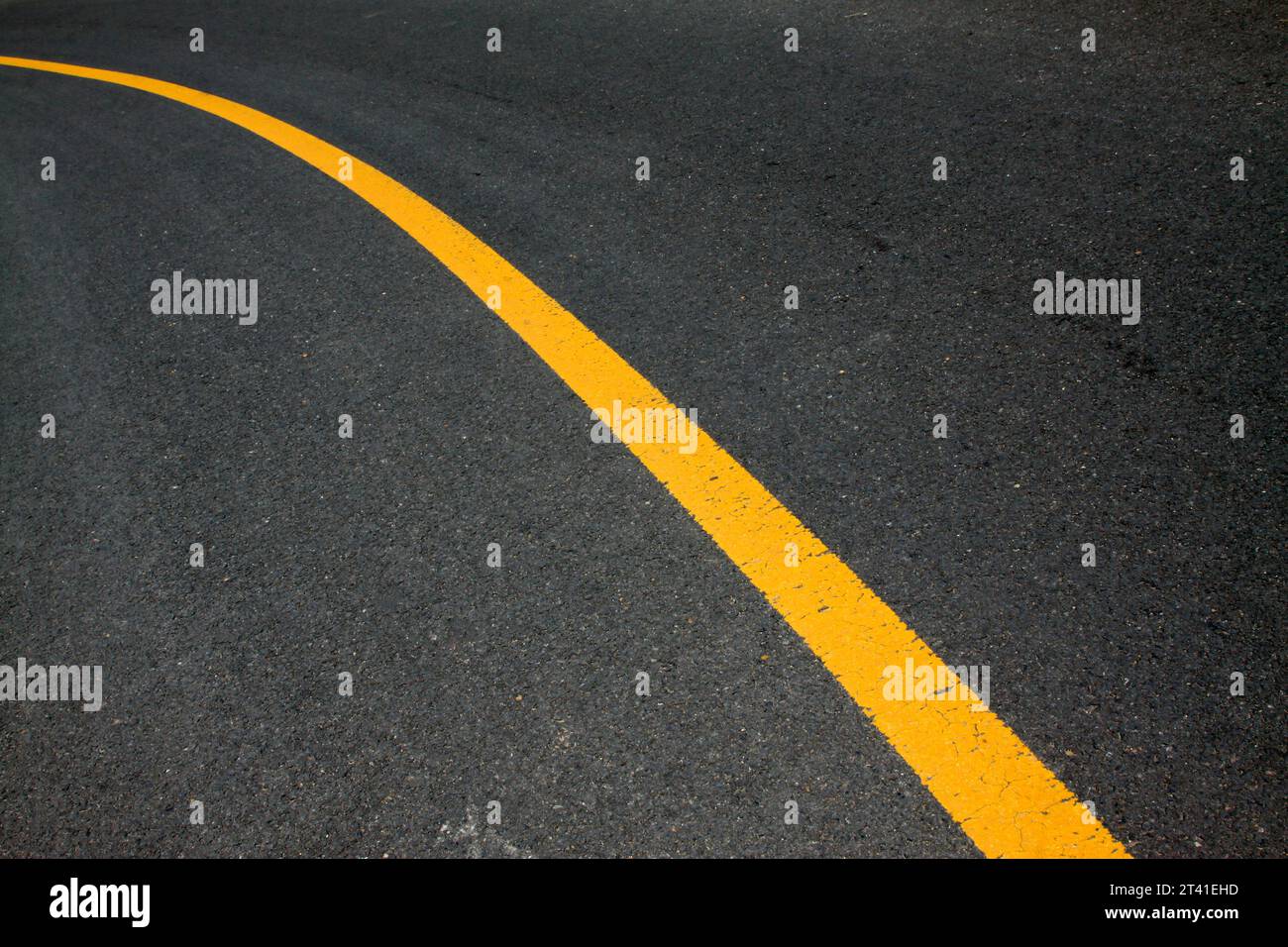 Yellow line on the asphalt road, closeup of photo Stock Photo - Alamy