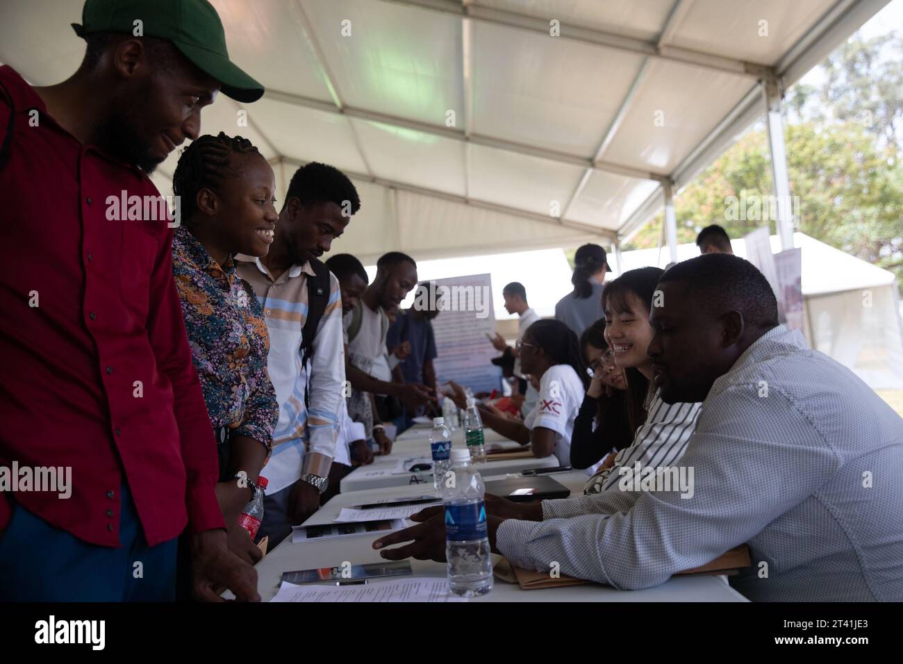 Lusaka, Zambia. 27th Oct, 2023. Job seekers talk to recruiters during a ...