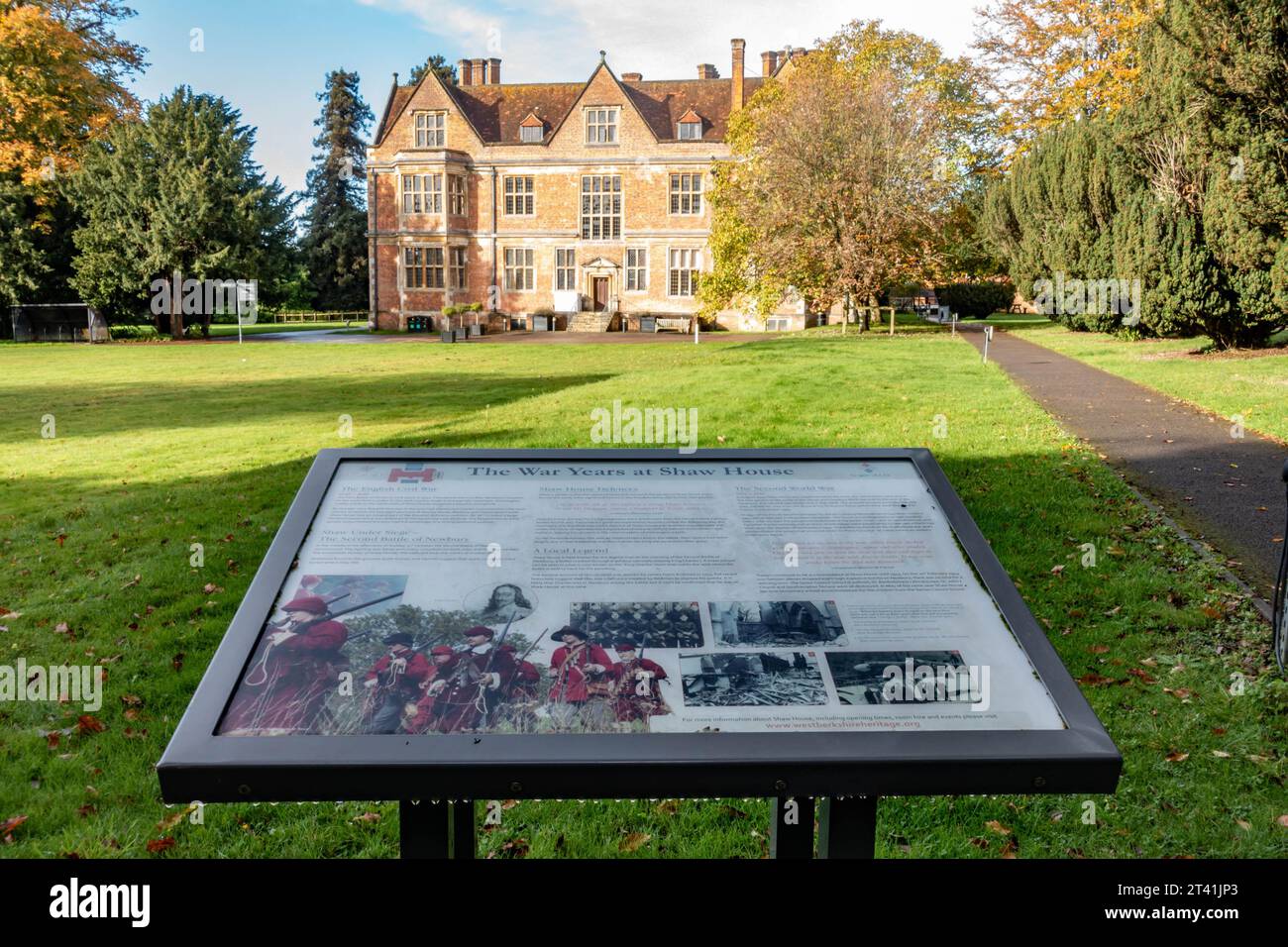 A side view of Shaw House across a green lawn in Newbury, Berkshire. An ...