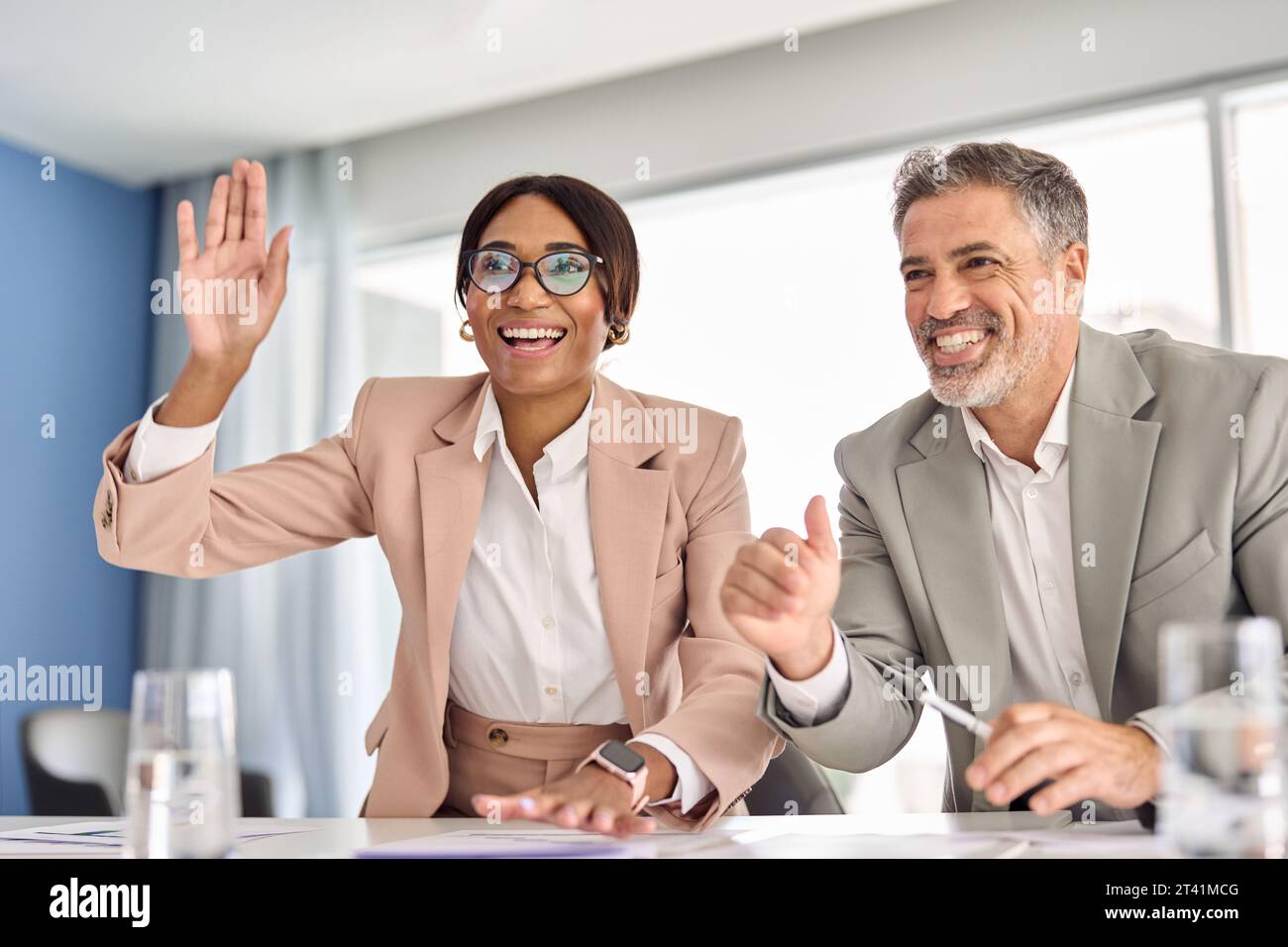 Happy international executive team leaders celebrating success at ...