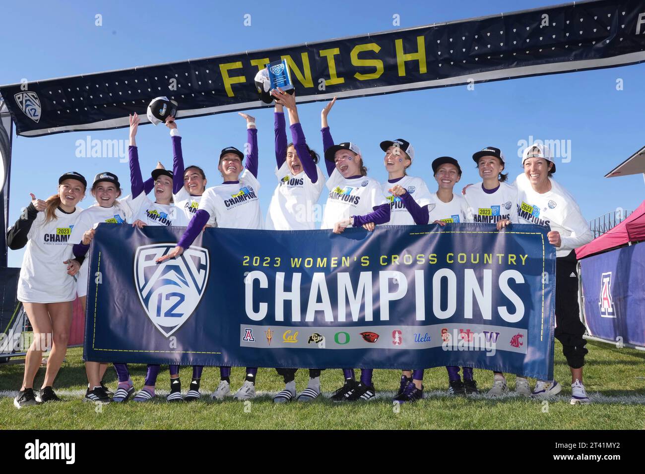 Members of the Washington Huskies women's team and coach Maurica Powell ...