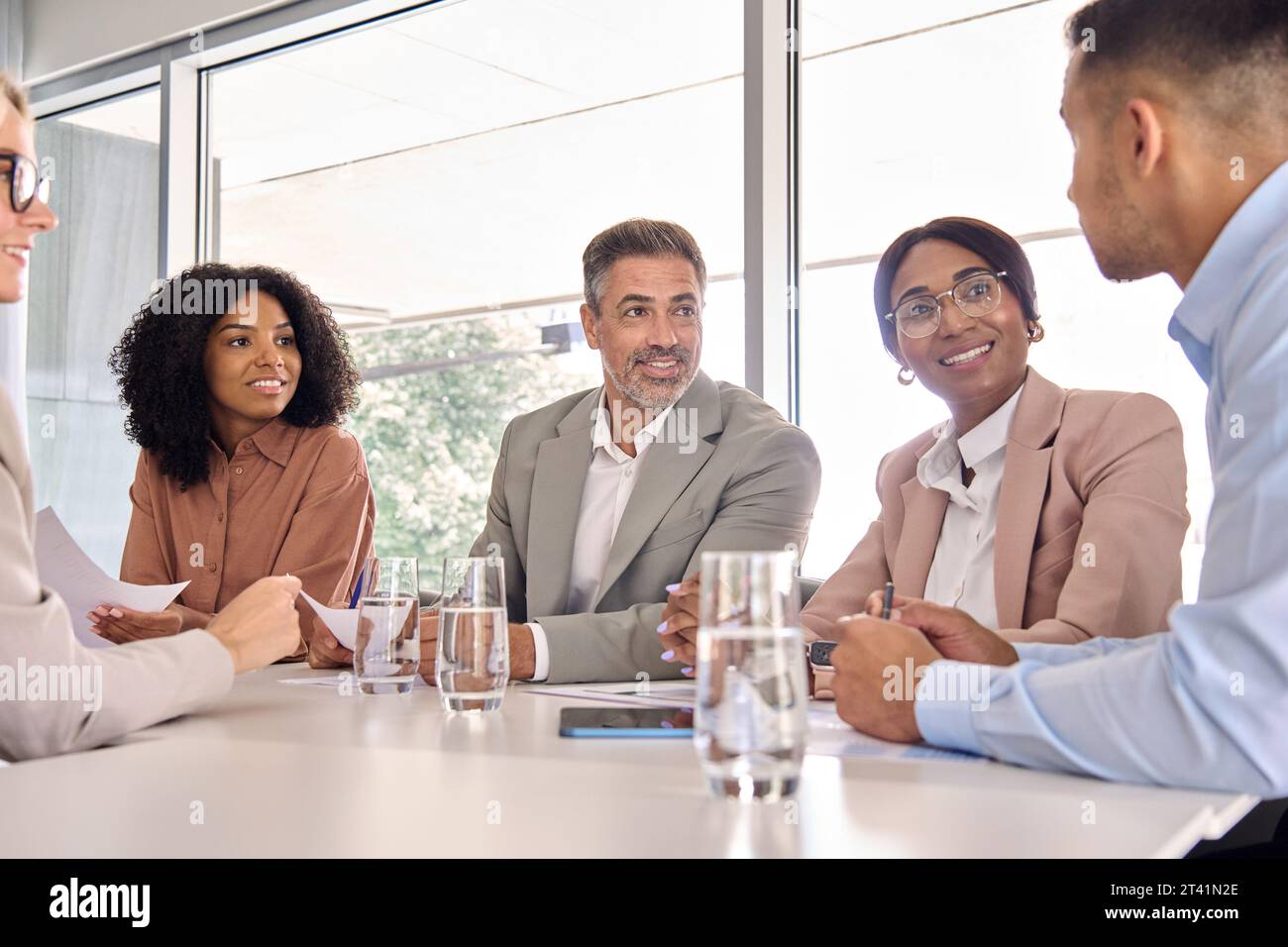 Happy busy diverse executive board business team at office meeting ...