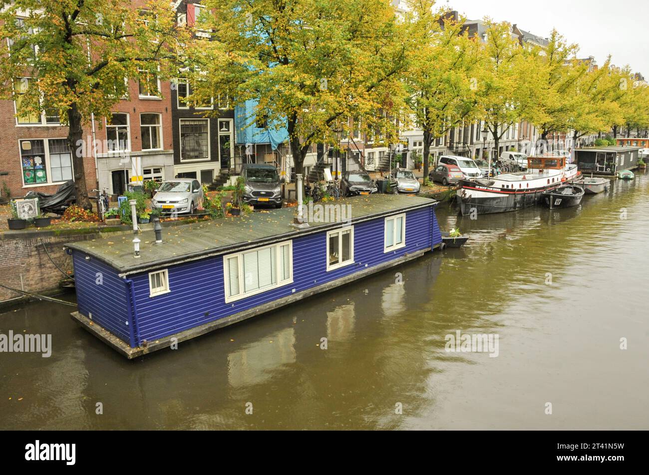 Boat houses on river in Amsterdam Stock Photo - Alamy