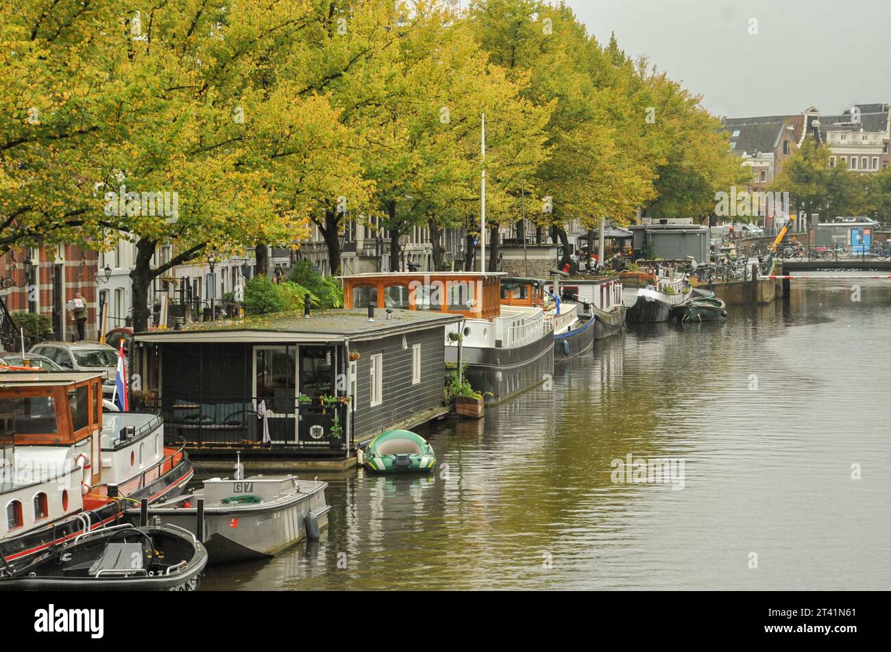 Boat houses on river in Amsterdam Stock Photo - Alamy