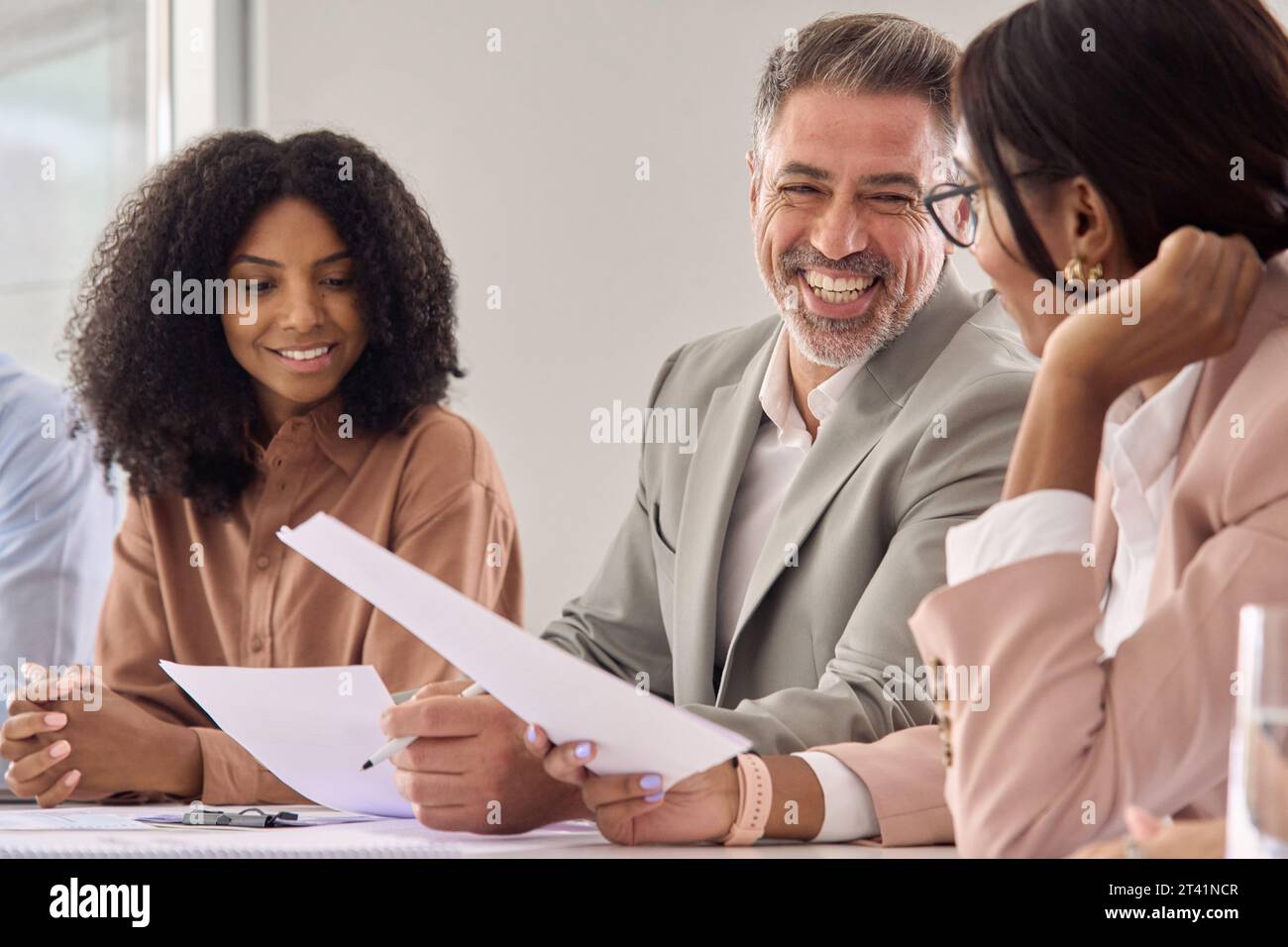 Busy happy smiling senior business man having conversation at office ...