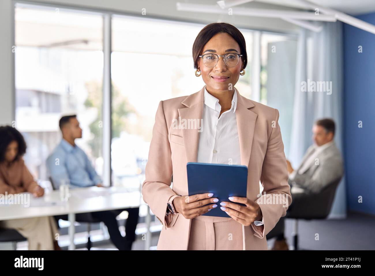 Elegant African American business woman leader standing at office ...