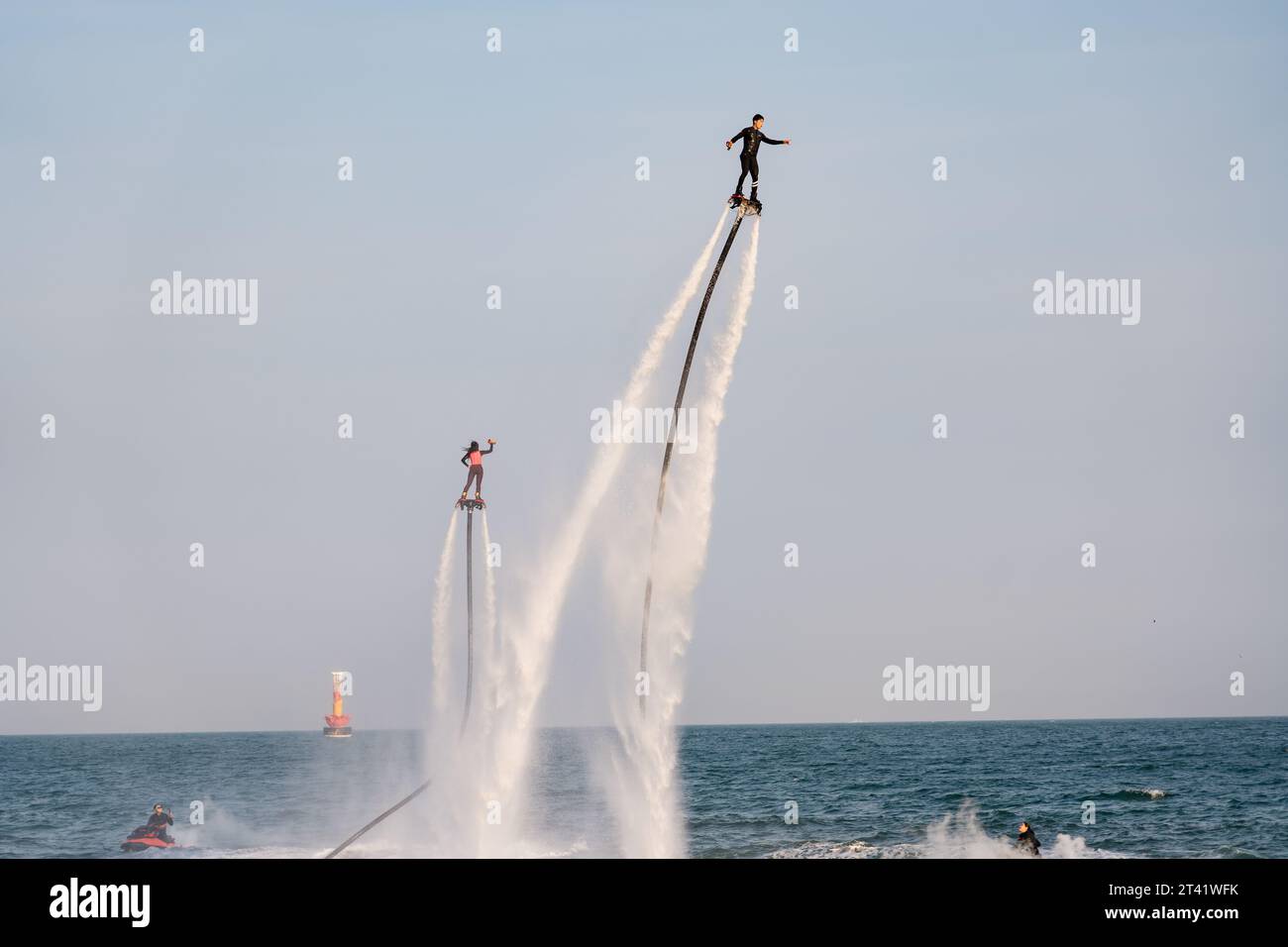 Busan, Korea -May 25, 2023: Two guys is playing the aquatic flyboard at ...
