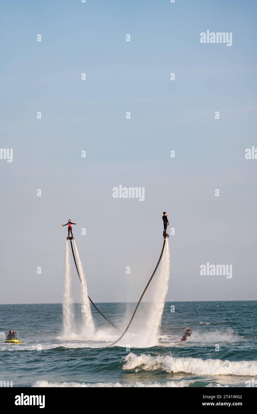 Busan, Korea -May 25, 2023: Two guys is playing the aquatic flyboard at ...