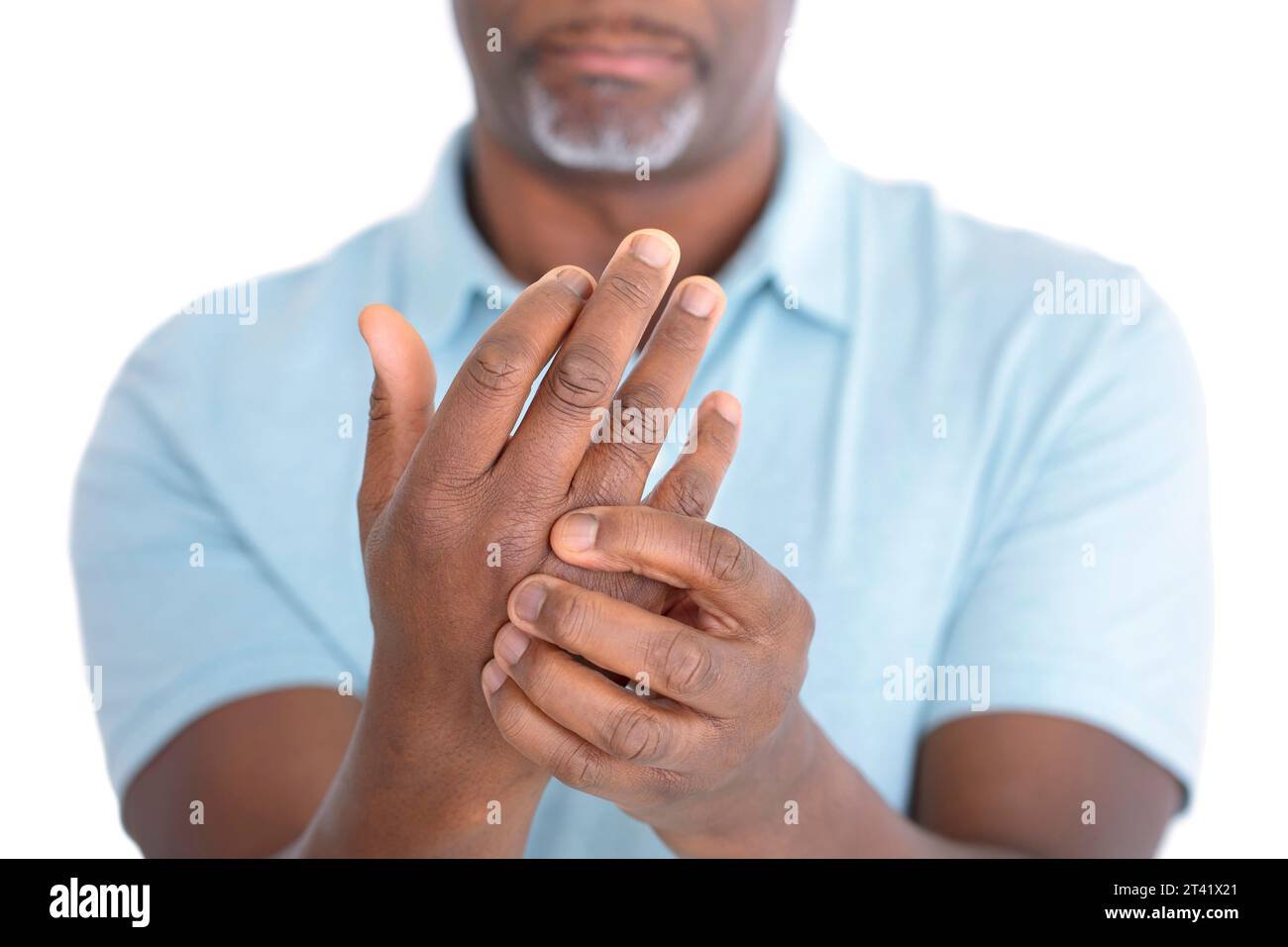 Man holding his painful hand Stock Photo - Alamy