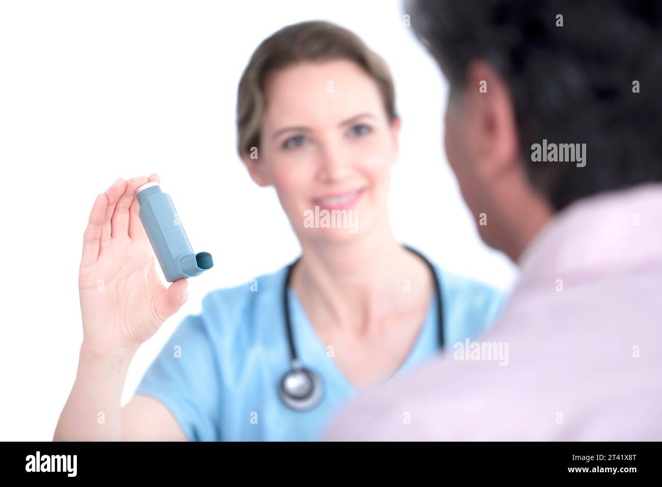 Doctor showing man inhaler Stock Photo - Alamy