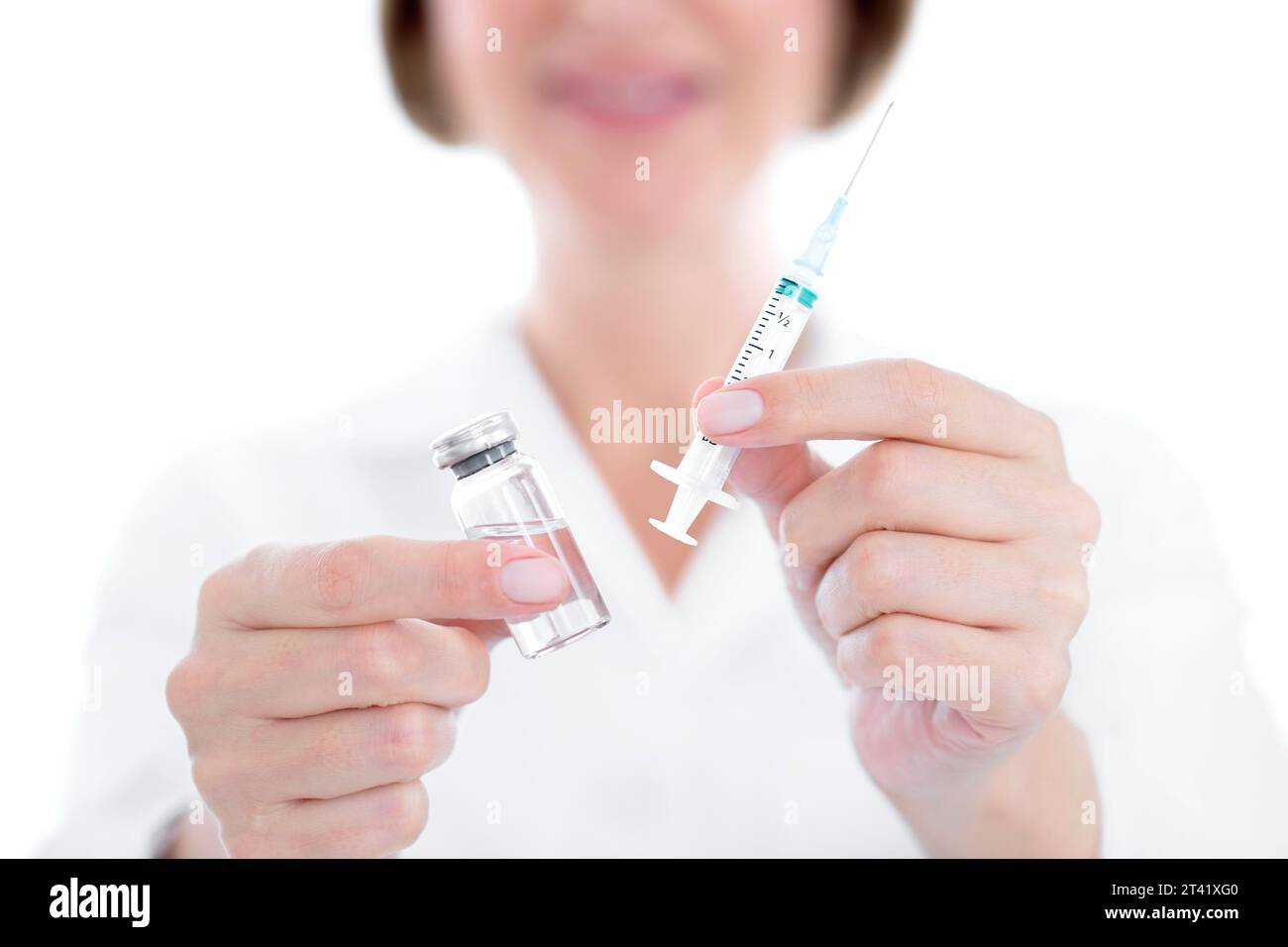 Doctor with syringe and phial Stock Photo - Alamy