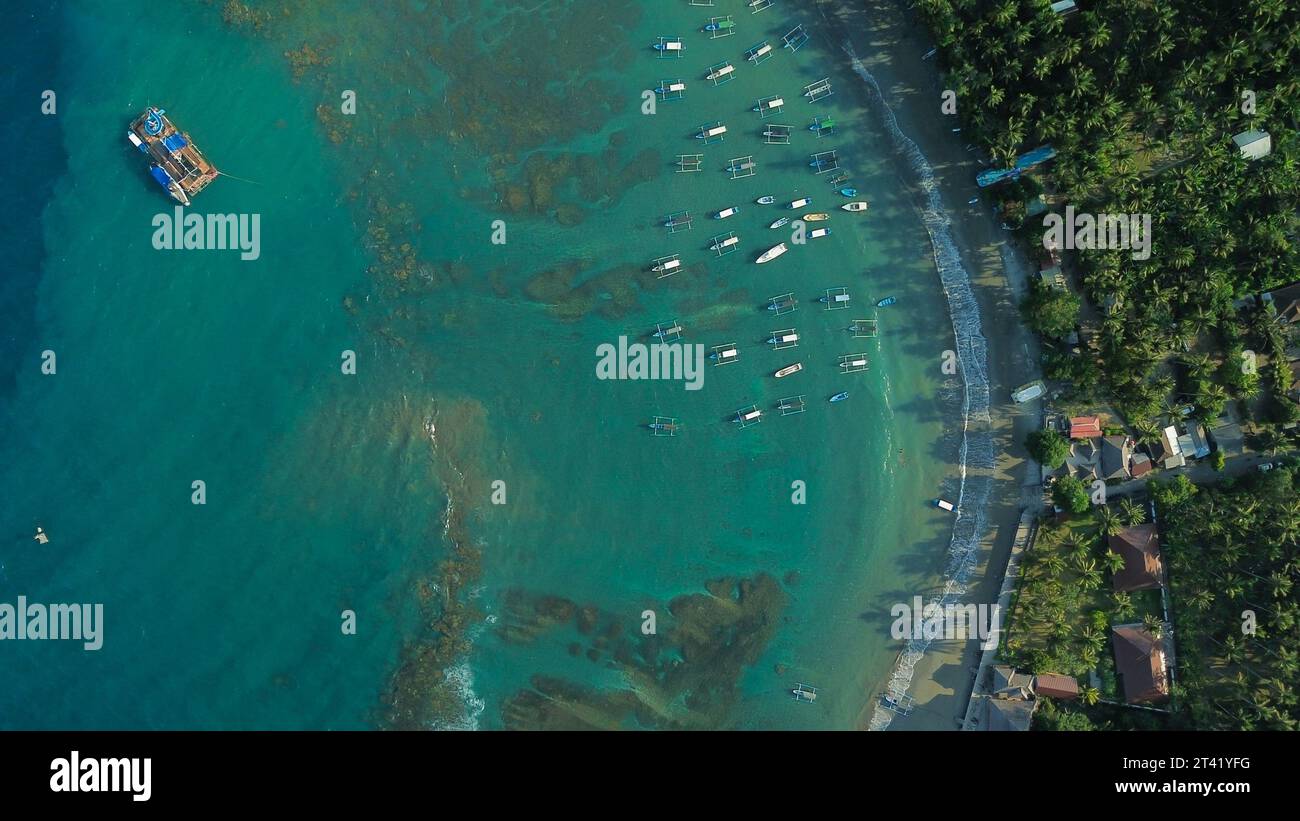 Aerial view of boats for diving trips parked off the shore of the Bali ...