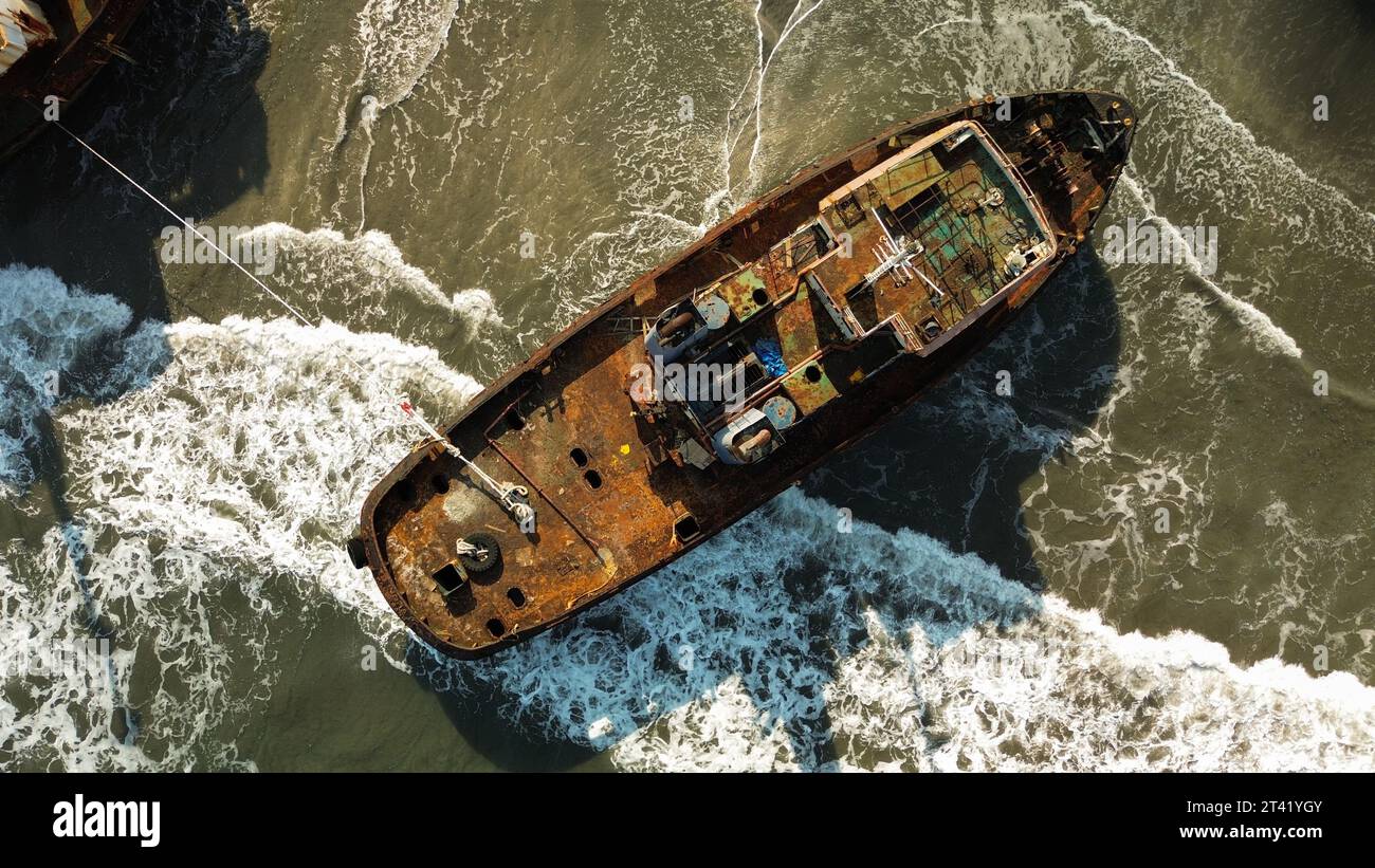 Top-down view of sunken ship covered with rust. Shipwreck in the ocean ...