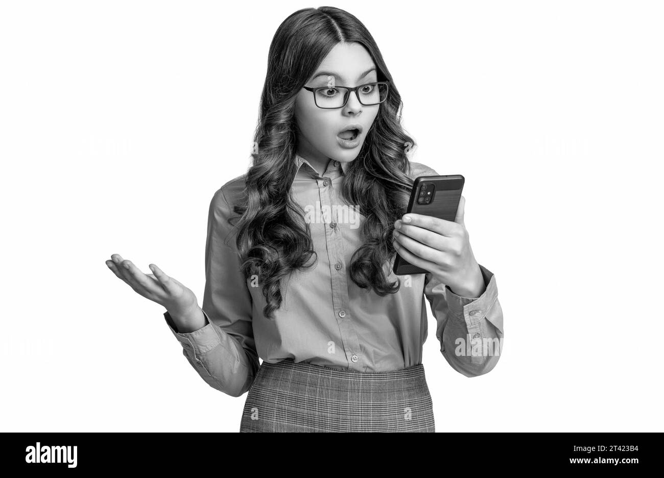 photo of shocked teen girl messaging on phone. teen girl messaging on ...