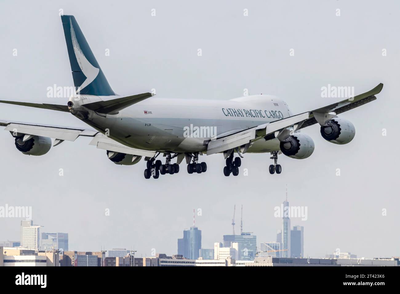 Aircraft on approach, B-LJH CATHAY PACIFIC BOEING 747-8F. Silhouette of ...