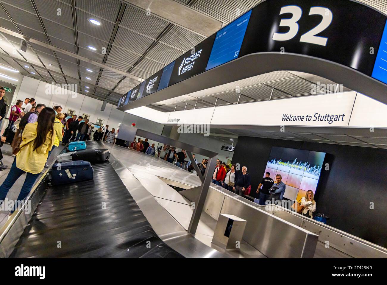 Baggage carousel at the airport, baggage claim, travellers waiting for ...