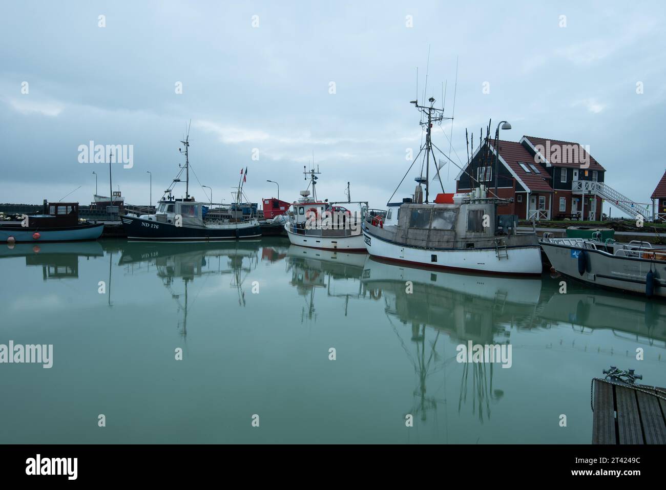 Fishing boats standing in the harbour of Klintholm Havn, Baltic Sea ...